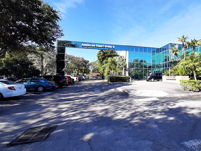 American Thrift Store's sleek glass facade brings upscale vibes to secondhand shopping. Reflections of palm trees add that unmistakable Florida touch.