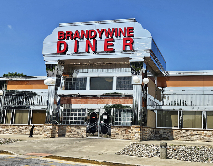 Brandywine Diner's gleaming chrome exterior shines like a beacon of burger hope on the highway. Retro looks, timeless taste!