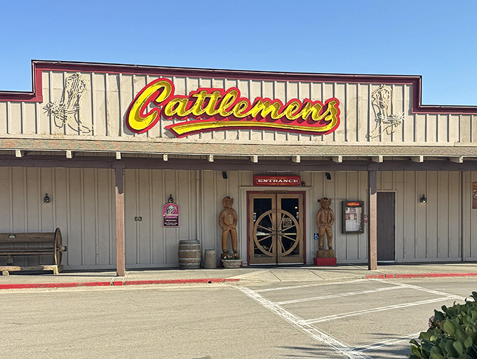 Those wooden cowboys aren't just decoration - they're standing guard over some serious beef territory.