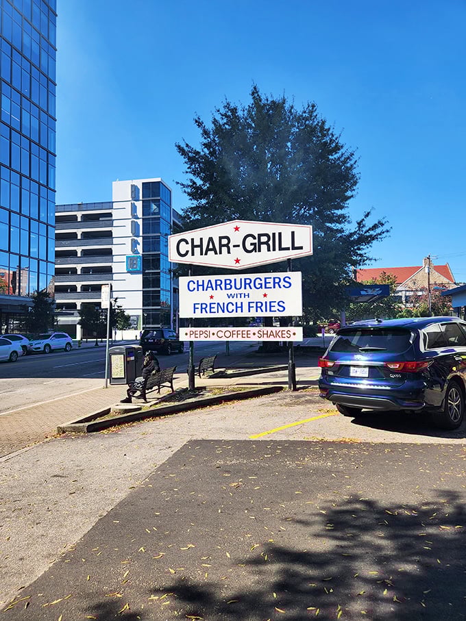 Char-Grill's iconic sign stands like a sentinel of satisfaction in downtown Raleigh, promising smoky delights to all who approach.