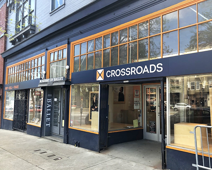 Crossroads' sleek navy exterior with golden window frames promises a more curated thrifting adventure.