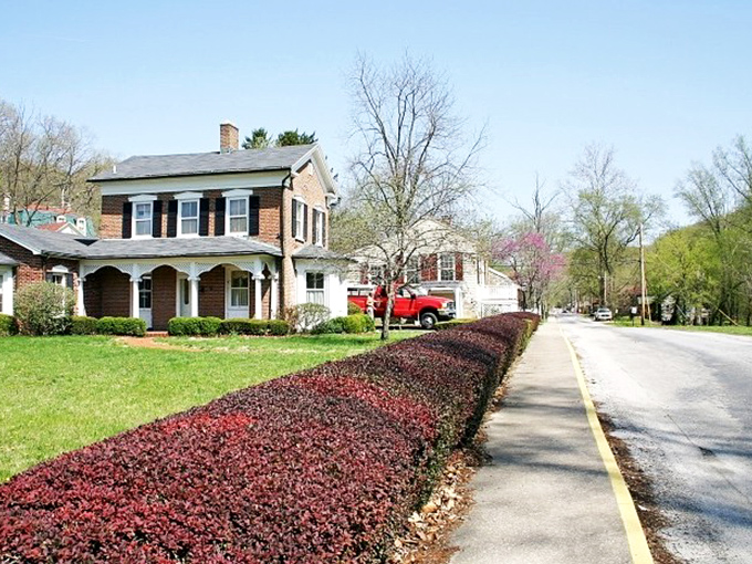 Elsah's historic homes nestle between bluff and river, looking like they grew naturally from the limestone landscape.