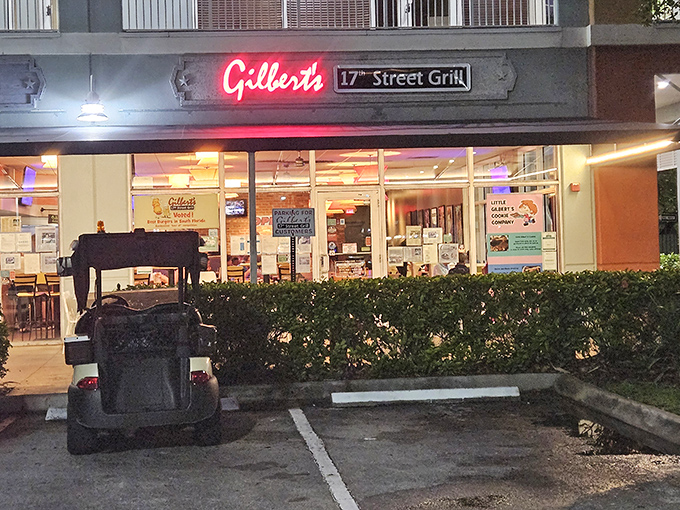 Gilbert's 17th Street Grill glows with neon promise. Behind those windows, burger magic happens daily.