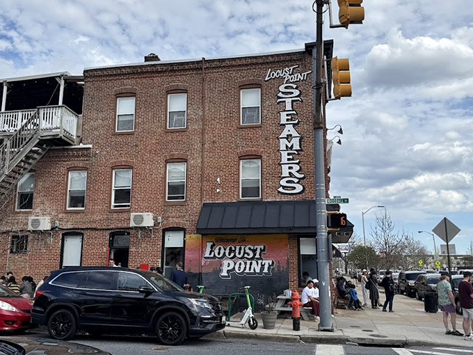 L.P. Steamers' corner brick building houses seafood dreams and rooftop views that capture Baltimore's salty soul.