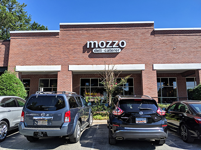 Mozzo's understated brick storefront in a strip mall - the Clark Kent of sandwich shops hiding Superman-level flavors. 