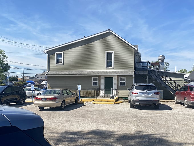 The sign's gentle curves mirror the nearby lake waves. Fuel up here before your water adventures!