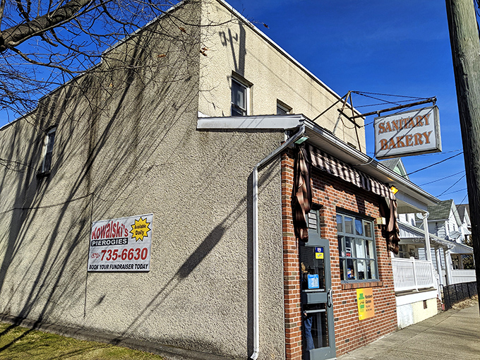 Sanitary Bakery's vintage sign swinging in the breeze is a portal to simpler times when calories didn't exist and diets were just a fad.