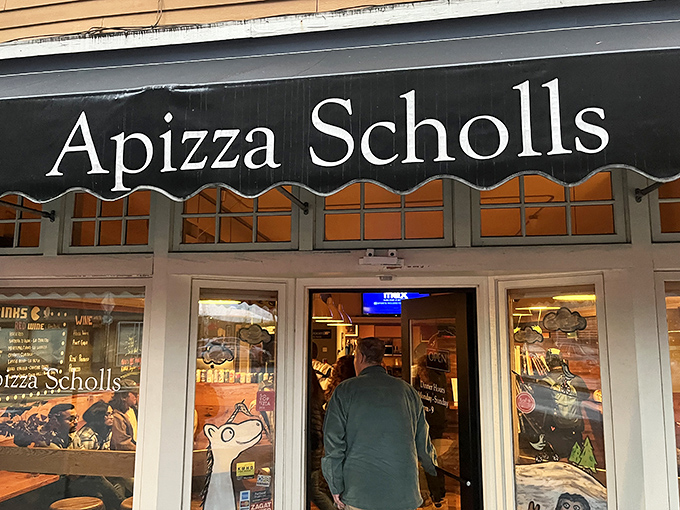 When the neon "OPEN" sign glows, pizza pilgrims know their New Haven-style prayers are about to be answered.