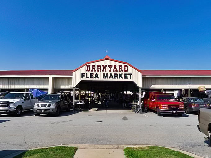 The distinctive red and white barn of Barnyard Flea Market &ndash; architectural charm that promises treasures inside!