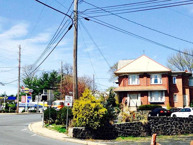 Sunlight bathes this quiet intersection where time seems to move at the pace of yesterday's memories.