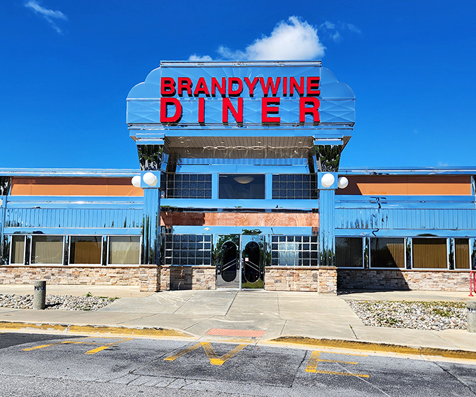 That classic diner silhouette against the blue sky? It's practically the official logo of "burgers done right."