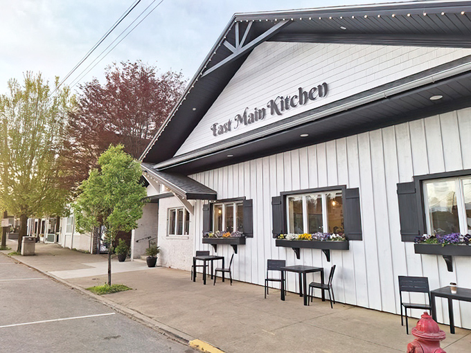 The soft morning light brings out the charm of East Main Kitchen. With blooming window boxes and cozy outdoor seating, this local gem is ready to welcome early visitors.