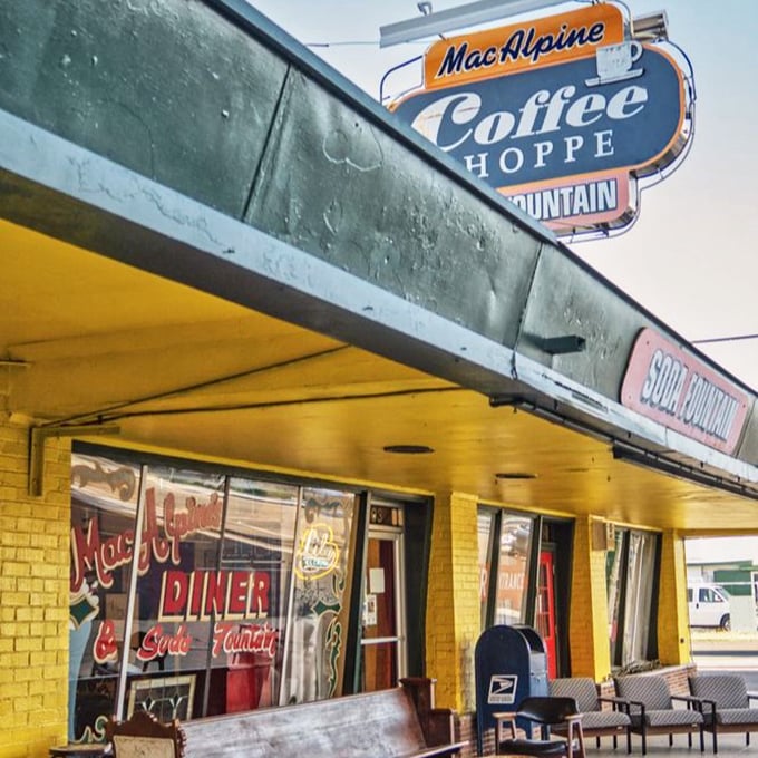 That retro "Coffee Shoppe" sign isn't just decoration &ndash; it's a portal to a time when soda jerks were artists and calories didn't count.