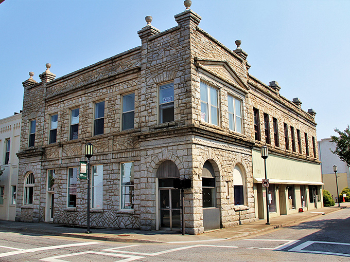 The historic stone building in Martinsville stands proudly on the corner, showcasing timeless architecture and small-town Virginia charm with every detail.