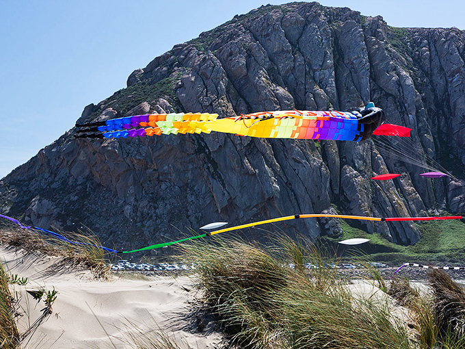 The colorful kites dancing above Morro Rock create a perfect contrast to the ancient monolith that defines this charming fishing town.