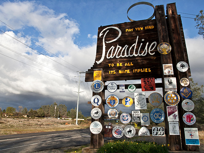 Paradise lives up to its name with this welcoming sign covered in community pride. Small town warmth in physical form!