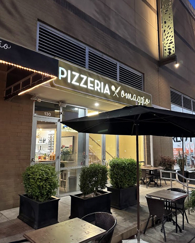 By night, Pizzeria Omaggio glows with possibility &ndash; those string lights promising wood-fired magic inside.