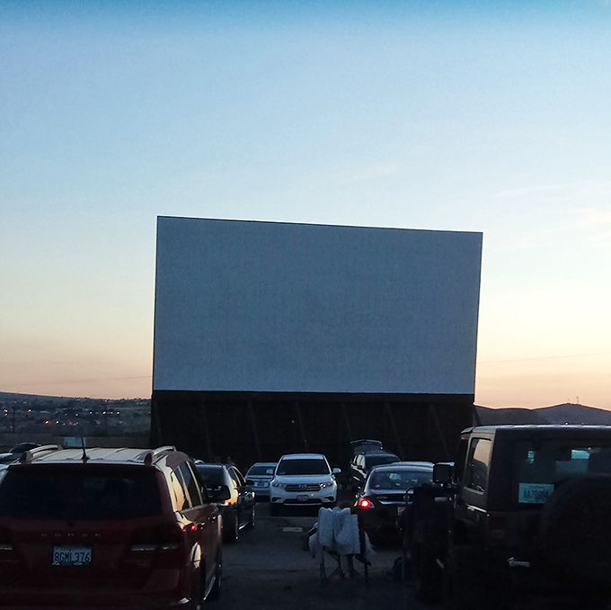 High desert, big screen! Skyline Drive-in's massive white canvas awaits the evening's feature presentation under Barstow's starry sky.