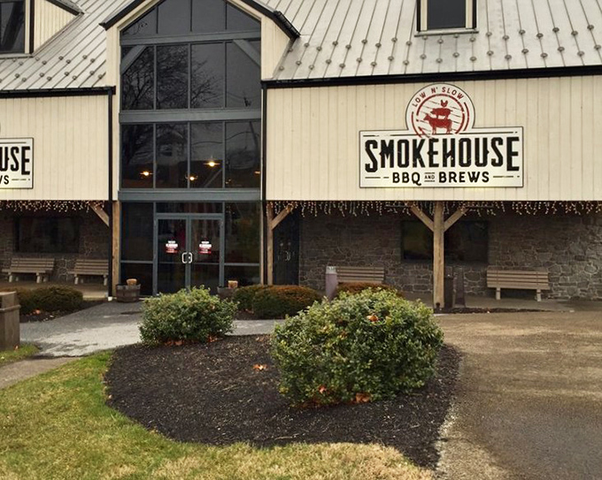 White siding and stone foundation&mdash;like the BBQ inside, Smokehouse blends tradition with solid craftsmanship.