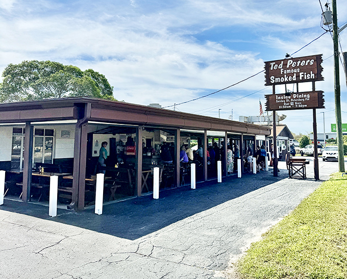 This is what "no frills" really means &ndash; just smoke, fish, and happy people eating outside.