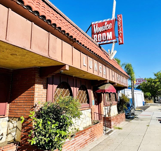 The Venice Room's timeless facade promises old-school steakhouse charm where every cut is prepared with decades of culinary wisdom.