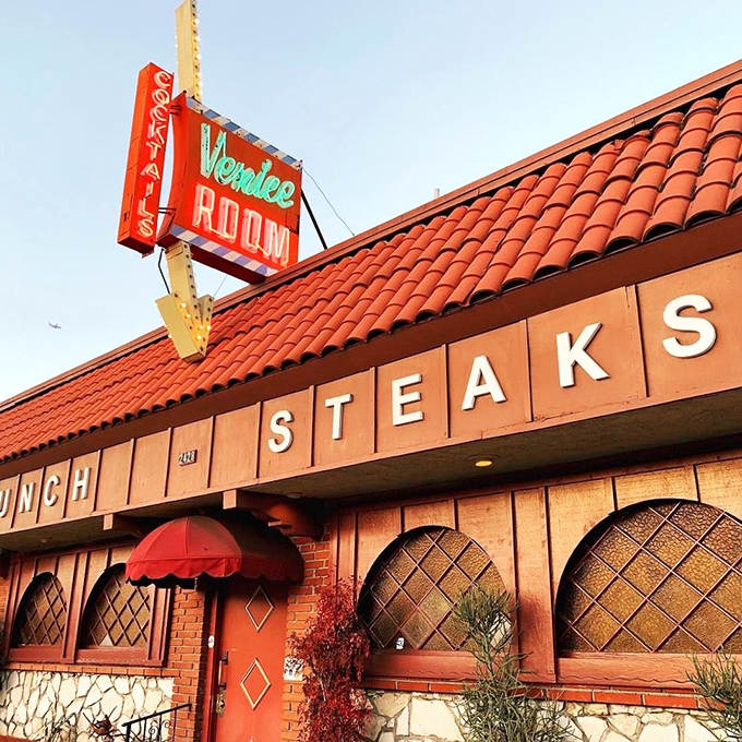 Mid-century magic awaits at The Venice Room. That classic neon sign has guided hungry patrons to this cook-your-own-steak institution for generations.