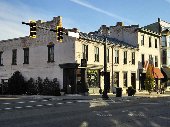 The warm glow of light transforms these white buildings into a scene that feels both timeless and uniquely American.
