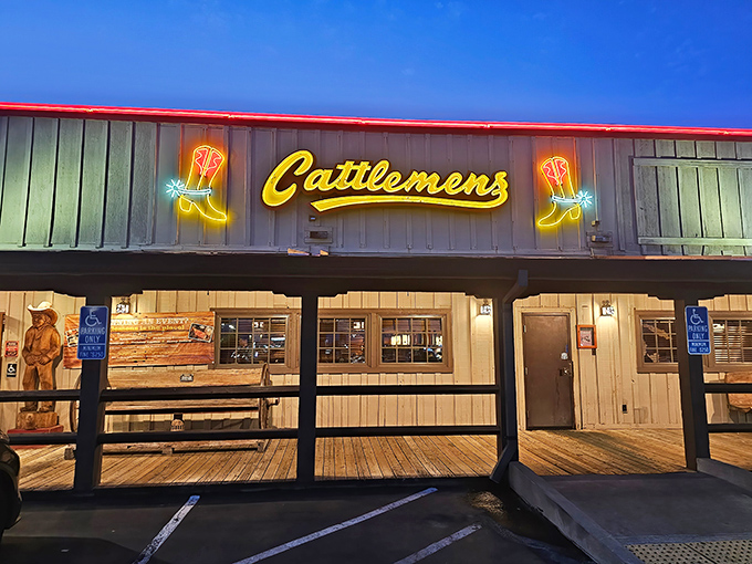 The iconic neon boot sign at Cattlemens beckons hungry travelers like a beacon of beefy salvation in Dixon's evening sky.