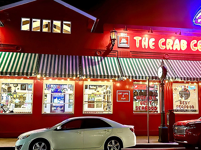The crimson beacon of Newport Beach beckons seafood lovers like a maritime lighthouse. The Crab Cooker's iconic red exterior and green-striped awnings promise no-nonsense deliciousness inside.