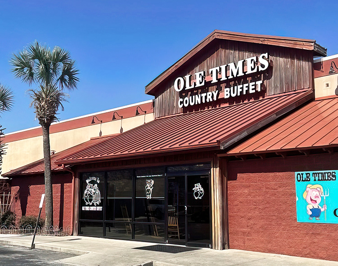 The red-roofed sanctuary of Southern comfort food stands proudly against the Florida sky, palm trees offering a tropical salute to down-home cooking.