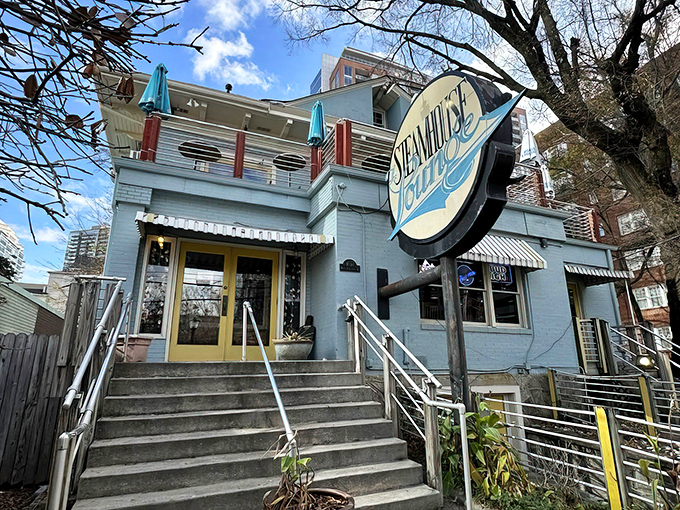 The light blue exterior with cheerful yellow accents feels like a coastal secret hiding in plain sight in Atlanta's urban landscape.