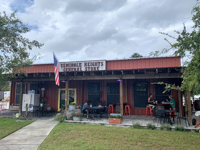 The rustic red exterior of Seminole Heights General Store stands as a humble invitation to one of Tampa's best-kept culinary secrets.