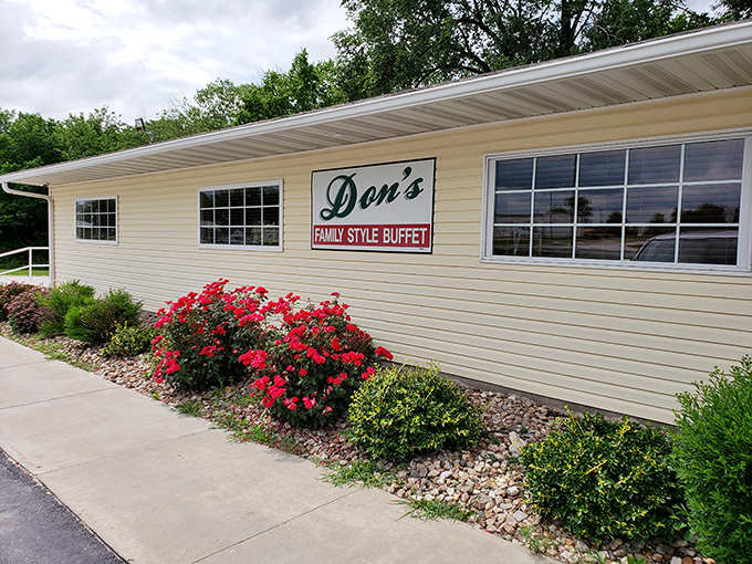 The unassuming exterior of Don's might not stop traffic, but those vibrant red flowers hint at the colorful flavors waiting inside this Huntsville treasure.