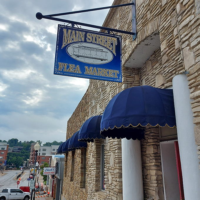 The iconic blue sign beckons treasure hunters to Branson's stone fortress of finds. Blue awnings add a touch of vintage charm to this Main Street landmark.