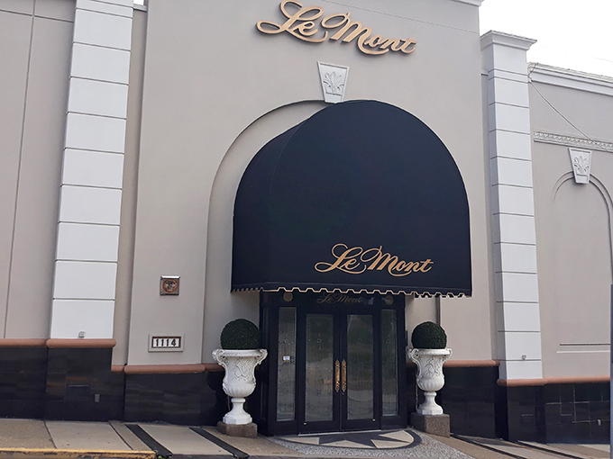 Le Mont's elegant exterior promises what awaits inside &ndash; a navy blue awning and classic architecture that whispers, "Yes, tonight is special."