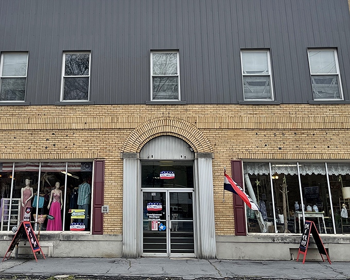 The classic yellow brick fa&ccedil;ade of Our Town Boutique beckons with the promise of hidden treasures behind its arched entrance.