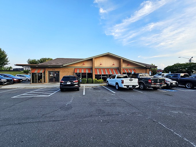 The unassuming brick exterior with cheerful striped awnings houses more culinary joy than most fancy establishments with valet parking.