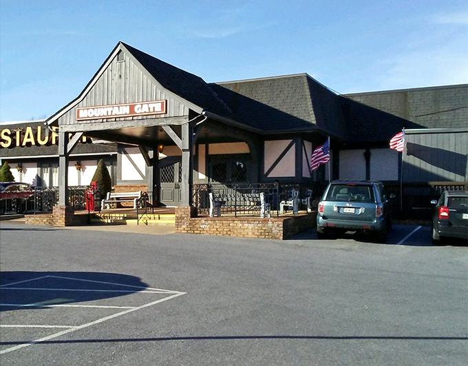 The Tudor-style facade of Mountain Gate Family Restaurant stands proudly against Maryland's blue skies, promising comfort food that'll make your stomach do a happy dance.