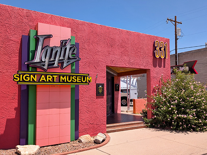 The vibrant pink exterior of Ignite Sign Art Museum stands out like a neon flamingo in the Tucson landscape, beckoning visitors with its glowing promise of nostalgia.