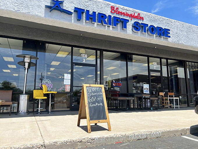The blue and red signage of Blessingdales beckons bargain hunters like a retail oasis in the desert, complete with sidewalk specials on furniture.