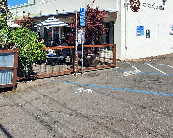 The unassuming exterior of Bacon & Butter belies the breakfast magic happening inside. A wooden patio and striped umbrellas welcome hungry patrons to Sacramento's morning hotspot.