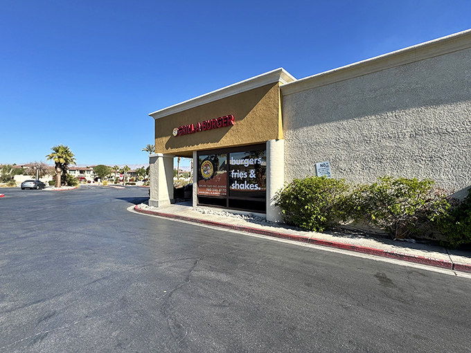 The unassuming exterior of Grill-A-Burger stands like a culinary oasis in the Palm Desert strip mall landscape. Burger paradise awaits.