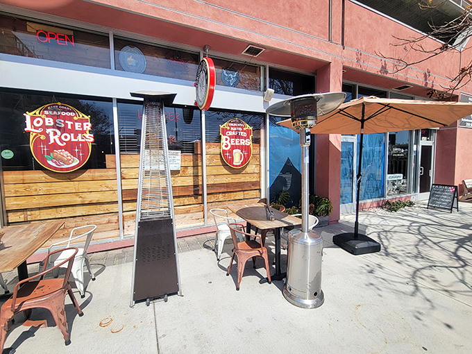 The neon "OPEN" sign beckons like a lighthouse for seafood lovers adrift in a sea of LA dining options.