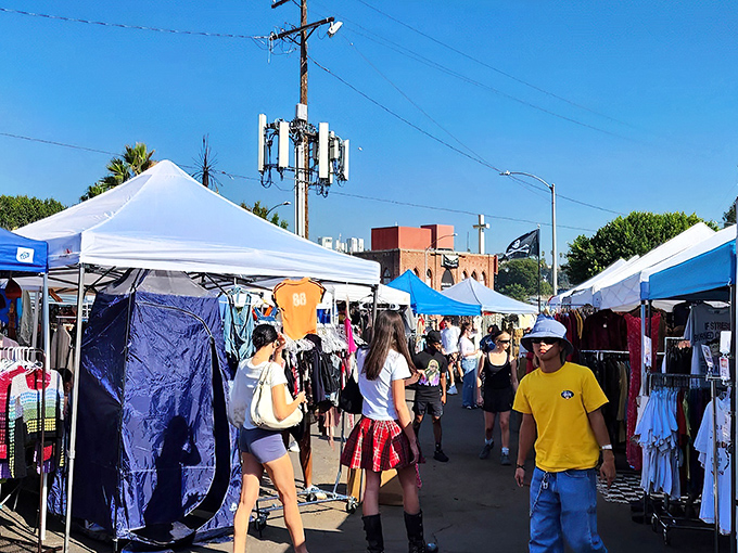 White tents line the pathway like a treasure map, guiding shoppers through a sea of vintage finds and handcrafted gems at Silverlake Flea.