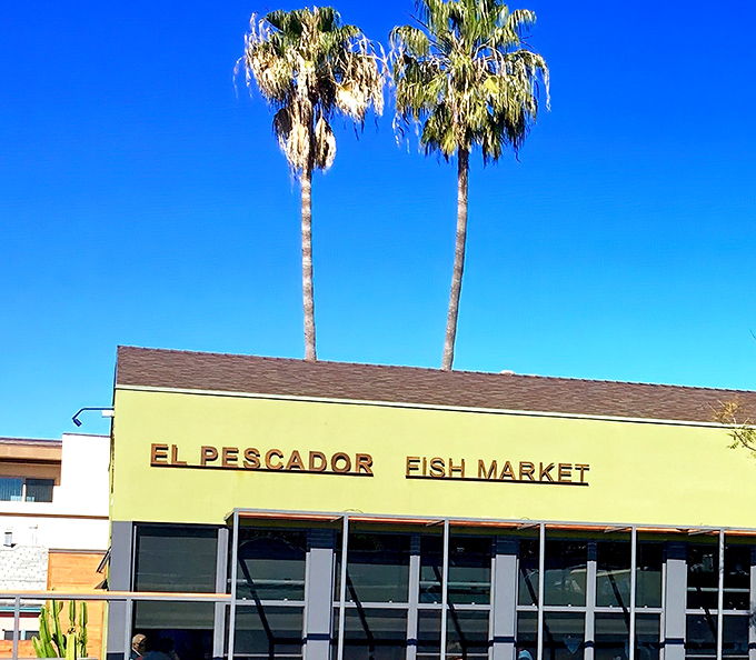 The iconic lime-green exterior with twin palm trees standing guard is La Jolla's seafood beacon, calling to fish lovers from miles around.