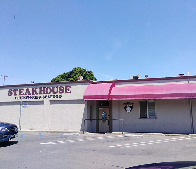 The unassuming exterior of Swiss Restaurant hides a carnivore's paradise within. Like finding a treasure chest disguised as a shoebox.