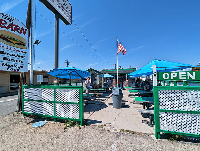 The Barn's cheerful green trim and blue umbrellas stand out against the Eastern Sierra sky like a mirage for hungry travelers on Highway 395.