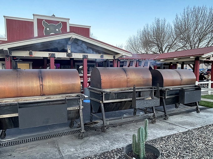Copper Top's legendary smokers stand ready outside the red-topped building, transforming ordinary meat into Eastern Sierra barbecue magic.