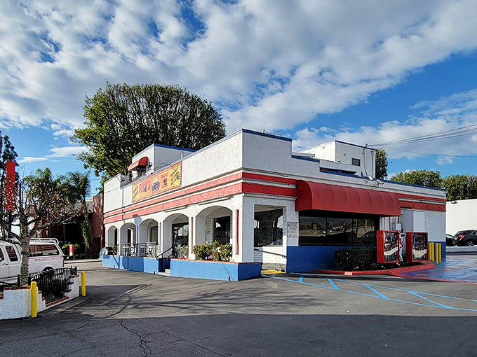 The red-and-white facade of Rick's stands like a time capsule on Whittier Boulevard, beckoning burger enthusiasts with its nostalgic charm.