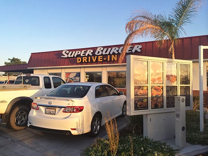 The iconic red and white facade of Super Burger Drive-In stands like a time capsule of Americana in Porterville, beckoning hungry travelers with its no-nonsense promise of satisfaction.